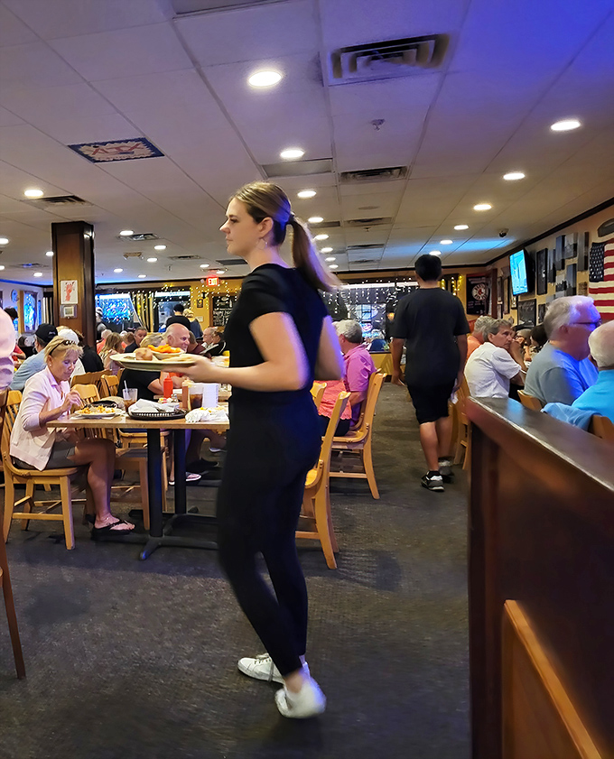 The staff moves with purpose, carrying plates of oceanic treasures. These are the unsung heroes of your seafood pilgrimage.