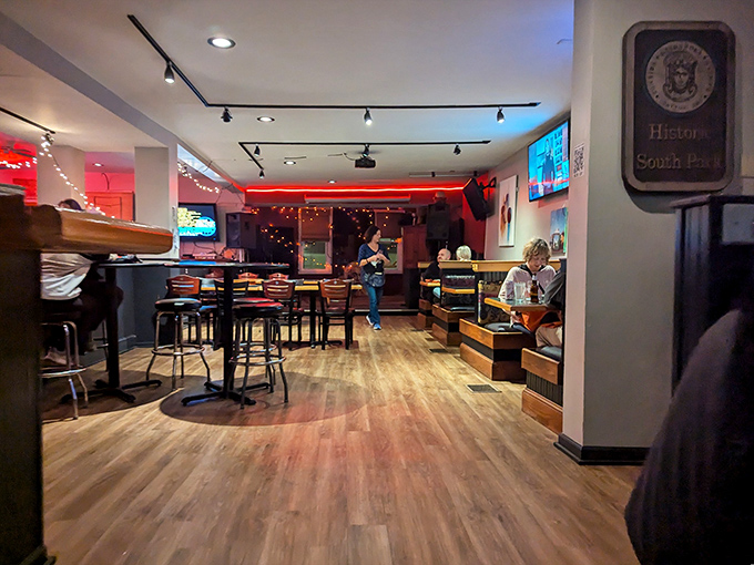 Warm wood tones and track lighting create the perfect backdrop for pizza pilgrimages. This space says "stay awhile" without having to say a word.