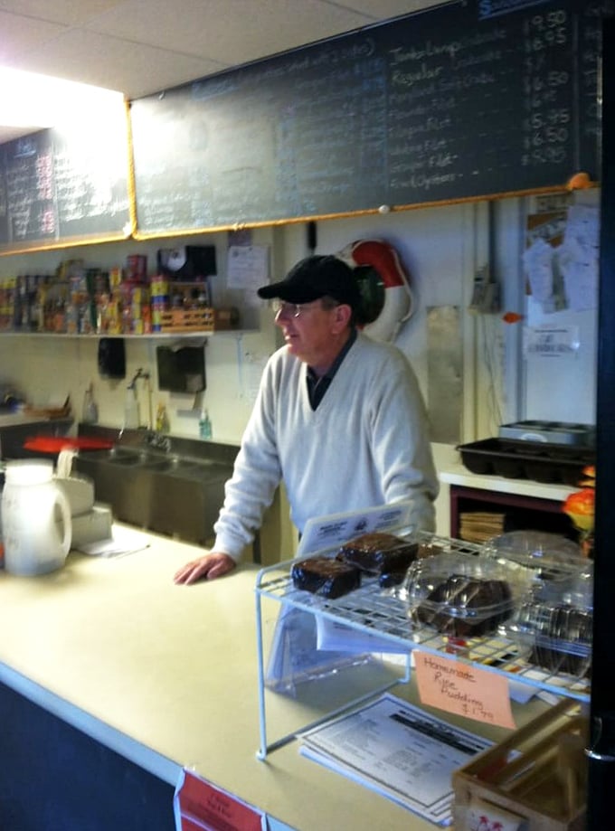 Behind every great seafood joint is someone who knows exactly how long to fry a shrimp. The white coat means business.