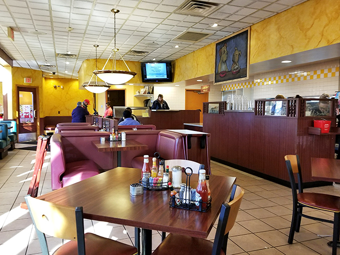 The warm yellow walls and classic diner layout create that "everybody knows your name" feeling, even on your first visit.
