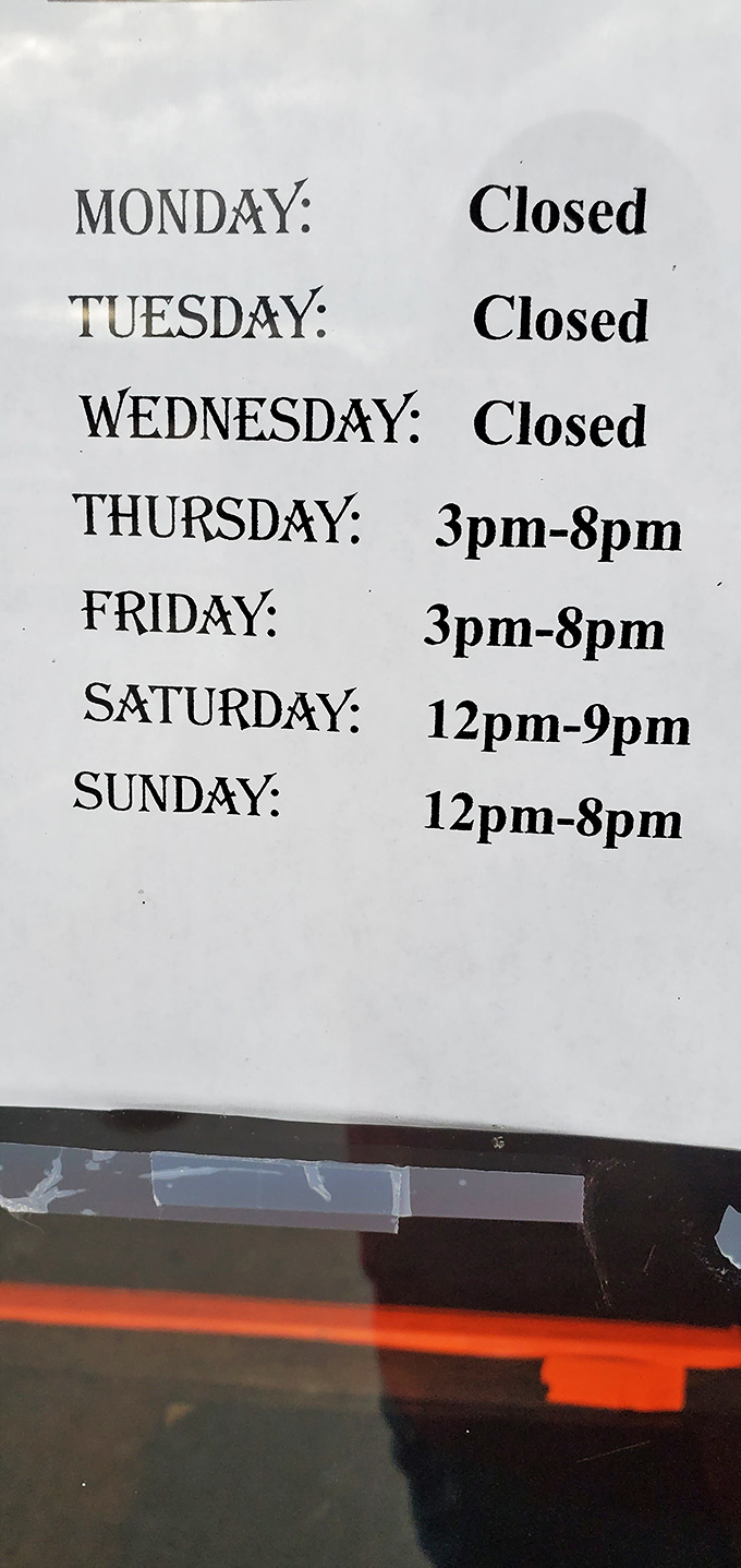 The hours sign tells a clear story: this seafood paradise requires recovery days. Thursday through Sunday, the nets are cast.