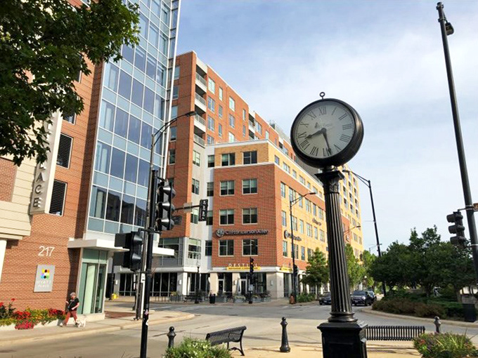 This clock doesn't just tell time &ndash; it anchors the neighborhood in a statement that says, "Yes, we're sophisticated, but we're never late for dinner."