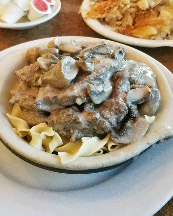 Beef Stroganoff over egg noodles&mdash;the kind of hearty, mushroom-laden comfort that makes you want to hug the chef and adopt them into your family.