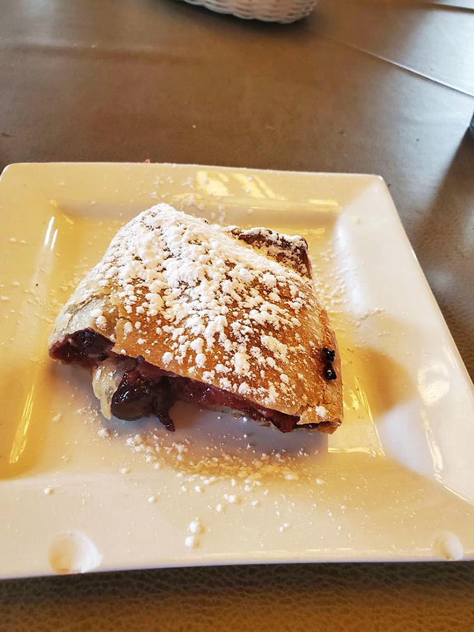 Strudel that whispers sweet nothings to your taste buds—flaky pastry, fruit filling, and a dusting of powdered sugar that makes everything right with the world.