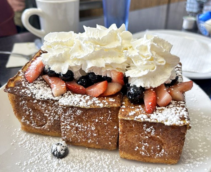 French toast that's dressed for a special occasion, topped with berries, whipped cream, and zero regrets. Breakfast that moonlights as dessert.