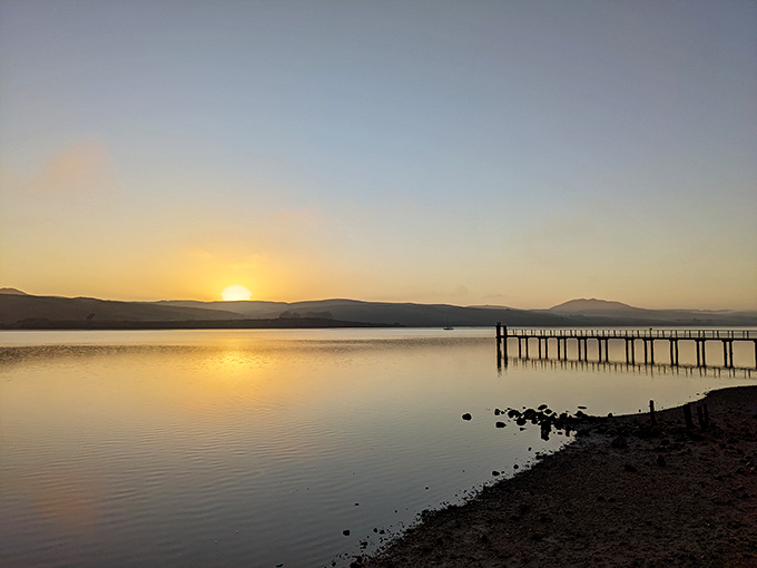 Tomales Bay sunset paints the water gold&mdash;nature's nightly show that doesn't require tickets or parking validation.