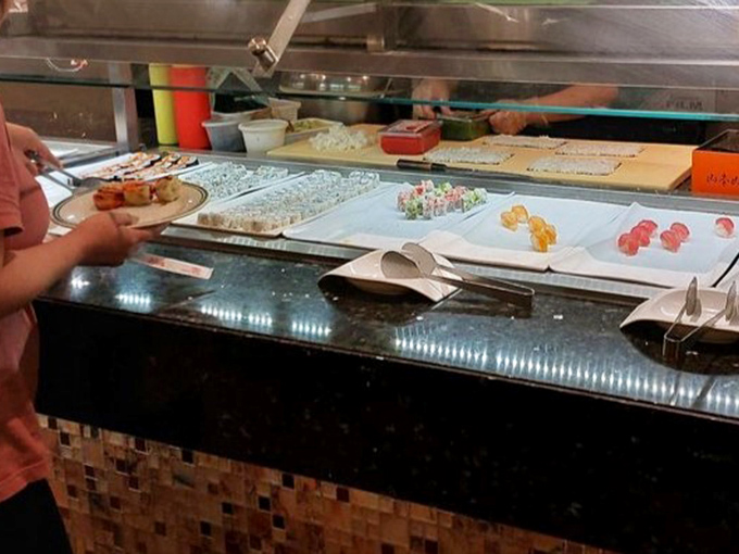 Colorful sushi displays that make choosing just one variety mathematically impossible. The solution? Multiple trips and zero regrets.