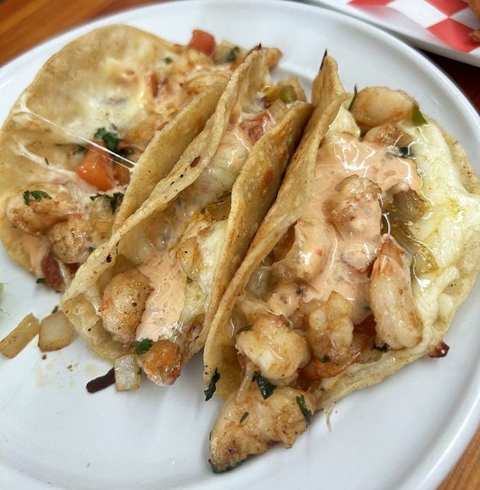 These shrimp tacos aren't just a meal, they're an event&mdash;creamy sauce, perfectly cooked seafood, and tortillas that know their supporting role.