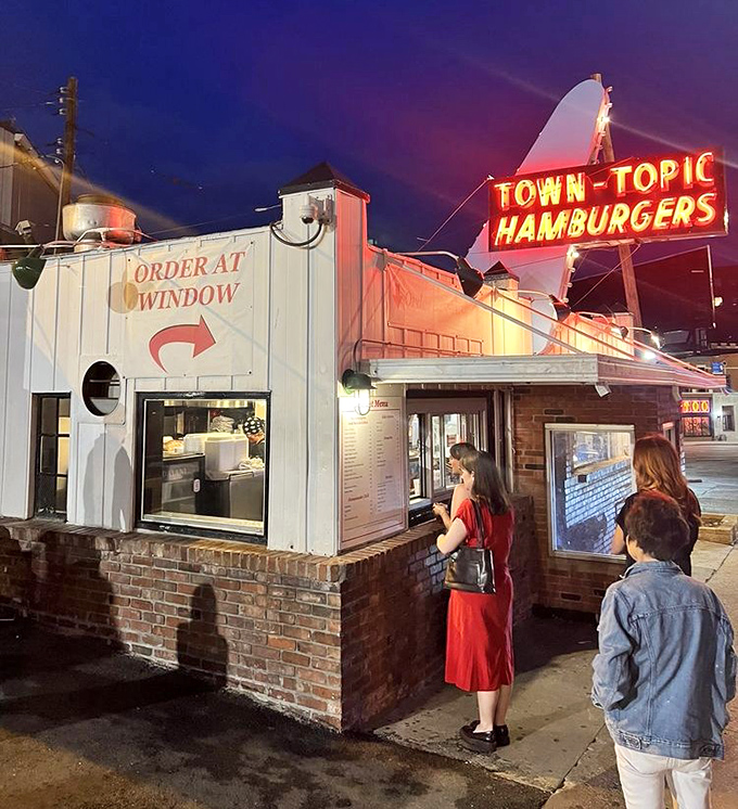 Night owls know the glow of the take-out window, a beacon of hope when midnight hunger strikes downtown.