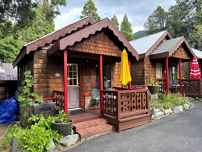 These storybook cabins with their gingerbread trim and cheerful red accents look like they should house woodland creatures from a fairy tale.