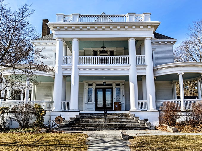 This grand white-columned mansion looks like it's waiting for someone to film the next great American period drama on its sweeping porch.