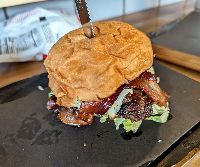 The Oakwood burger doesn't just sit on its plate&mdash;it commands attention. That perfectly toasted bun cradles its contents like a mother holding her delicious, bacon-topped child.