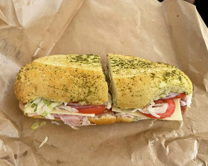 Behold the architectural marvel of meat, cheese, and veggies. This sandwich has more layers than your favorite mystery novel.