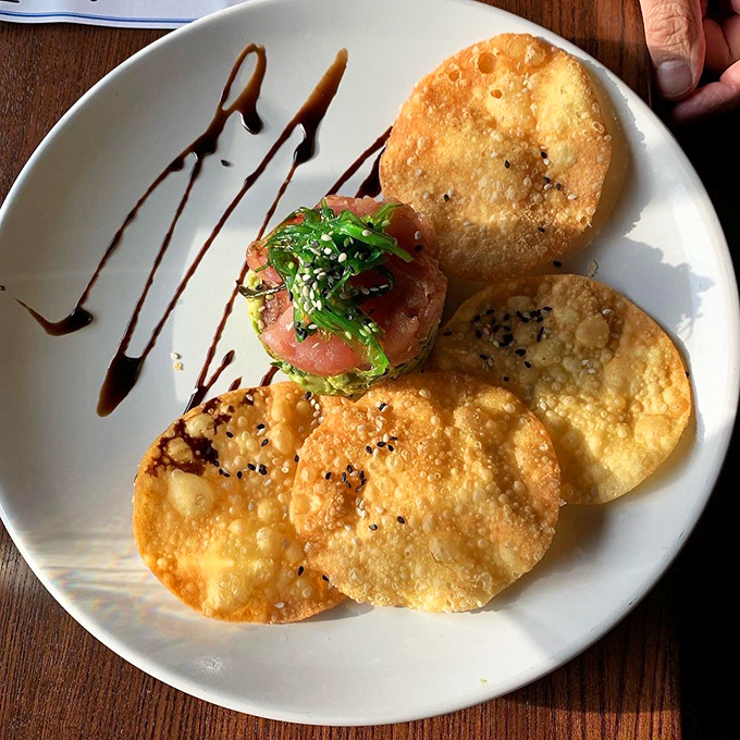 Tuna tartare surrounded by crispy wontons&mdash;proof that sometimes the best cooking happens when the chef decides not to cook at all.