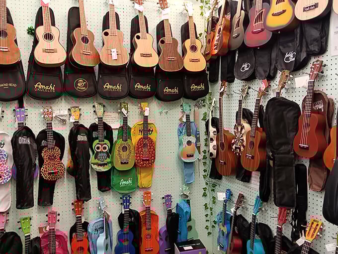A rainbow of ukuleles transforms a simple pegboard wall into a musical opportunity waiting to happen.