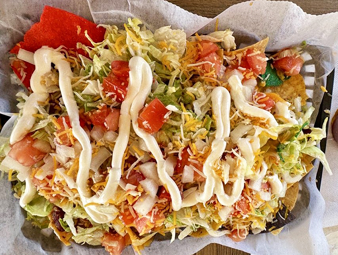These ultimate nachos don't understand the concept of empty space&mdash;every chip is a foundation for a tower of toppings and that zigzag of sauce.