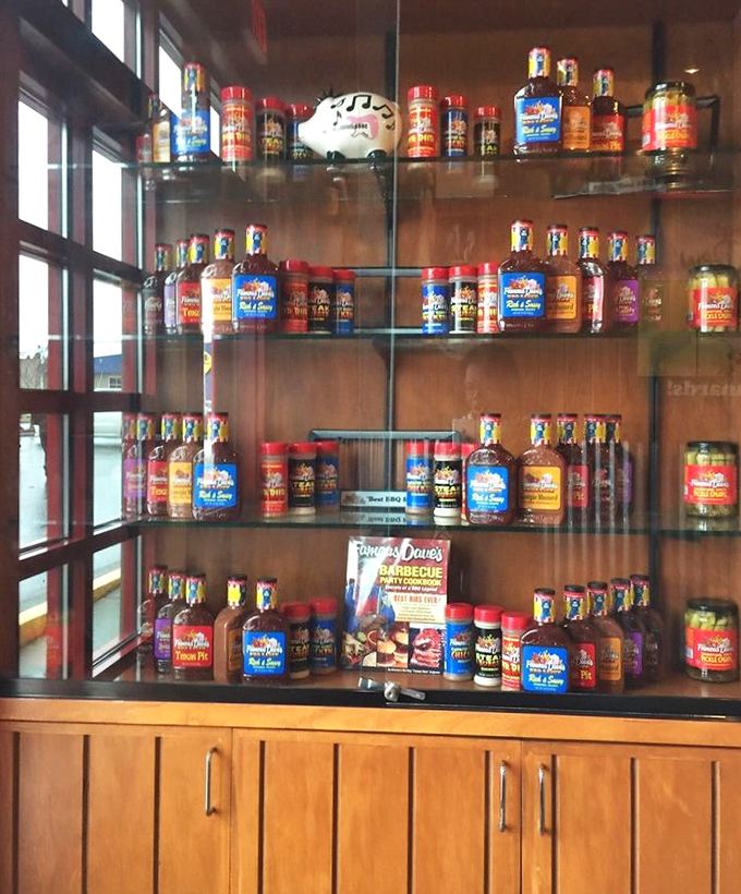 The sauce display case: a glass-enclosed museum of flavor possibilities that proves BBQ sauce collecting is a perfectly reasonable hobby.