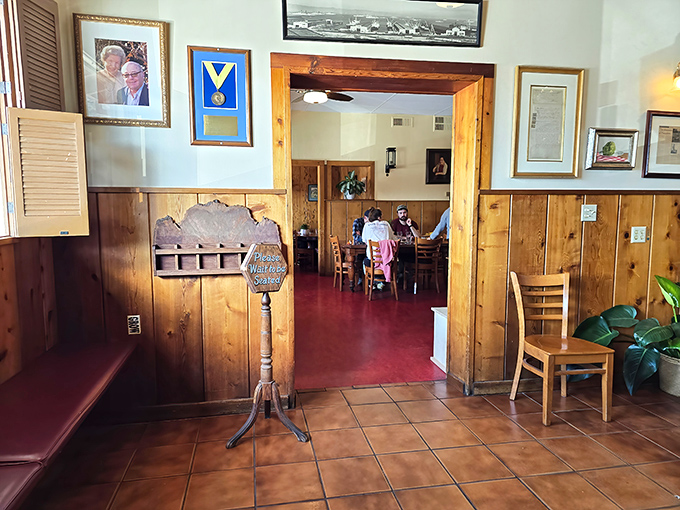 The waiting area's wooden details and vintage menu stand whisper, "Good things come to those who wait&hellip; especially our artichoke soup."