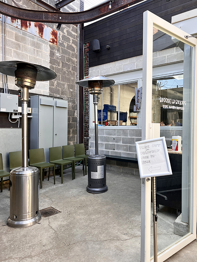 Even the waiting area feels special, with heat lamps ensuring your pre-pizza experience is as comfortable as possible.