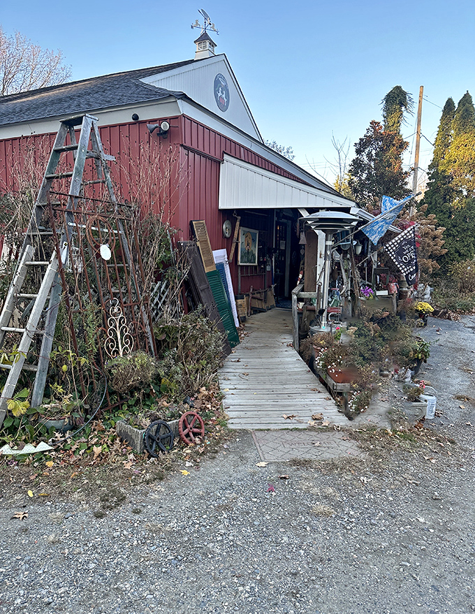 The wooden walkway practically whispers "follow me" as it leads you past garden artifacts and seasonal blooms toward vintage nirvana.