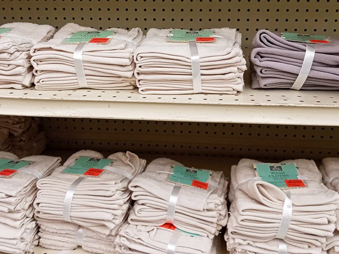 Stacks of pristine washcloths and towels that would make hotel housekeeping envious, all tagged with prices that feel like typographical errors.