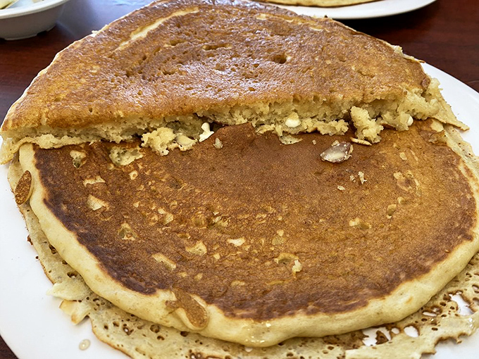 This pancake isn't just breakfast; it's an edible monument to the art of morning indulgence.