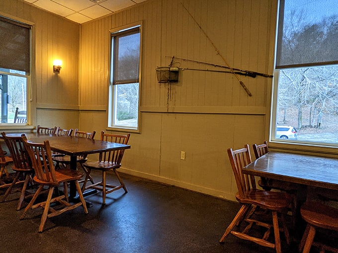 Simple wooden tables, fishing rod on the wall—this dining area knows exactly what it is: a shrine to unfussy, delicious eating.