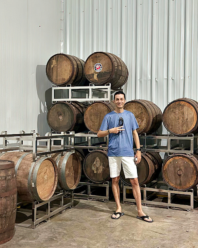 Wine barrels stacked like a wooden Jenga tower. Each one holds future memories, just waiting to be poured.