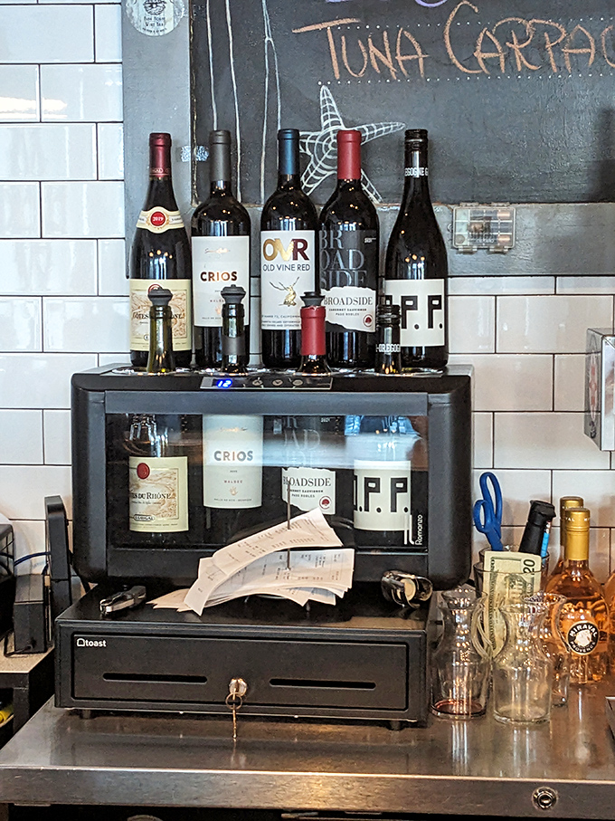 Wine bottles standing at attention, ready for their moment to shine alongside the day's fresh catch. 