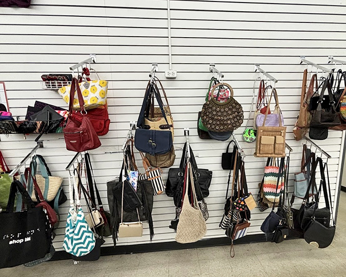 The handbag wall&mdash;where designer knockoffs and genuine vintage finds hang side by side in democratic fashion harmony.