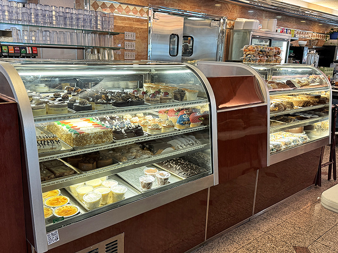 A dessert case that makes willpower crumble faster than their apple pie crust. Diet resolutions come here to die happy deaths.