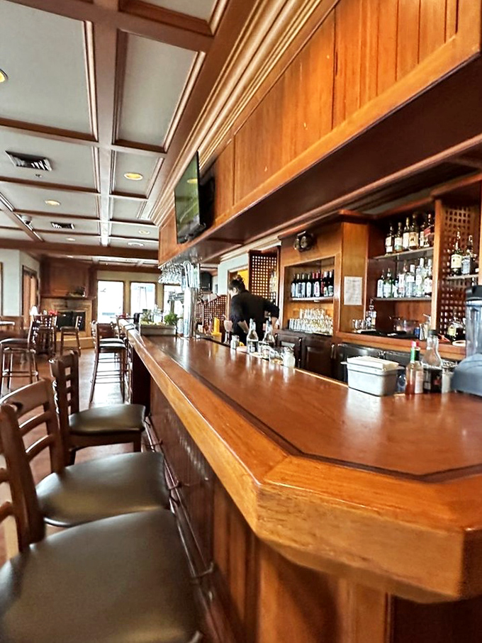 A bar that says "pull up a stool and tell me about your day" without saying a word. The polished wood has heard thousands of toasts and twice as many bad jokes.