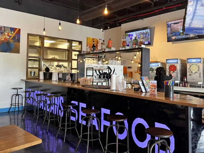 A bar that means business, illuminated with that signature blue glow. The perfect perch to sip something cold while waiting for your seafood bounty.