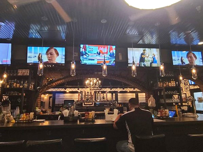 The bar area glows with possibility and ESPN. Where sports fans and sandwich enthusiasts find common ground over cold drinks.