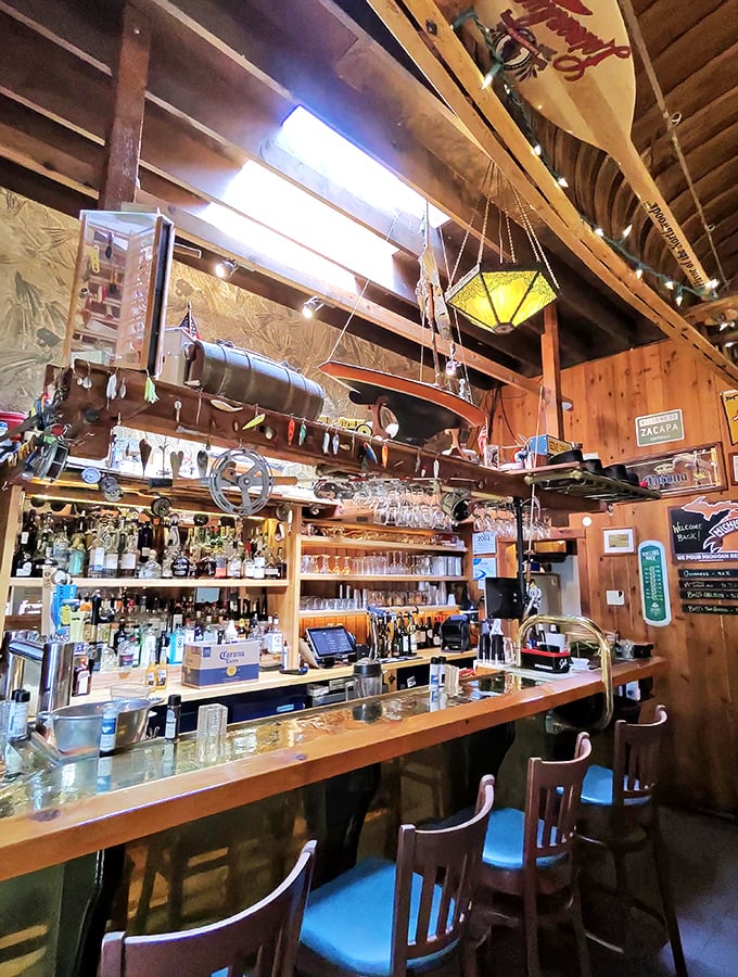 A bar that tells stories without saying a word. Every bottle, boat part, and weathered sign is a chapter in Leland's maritime history.