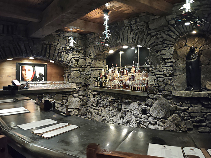 The cave's natural bar area seamlessly blends modern amenities with millions of years of geological artistry.