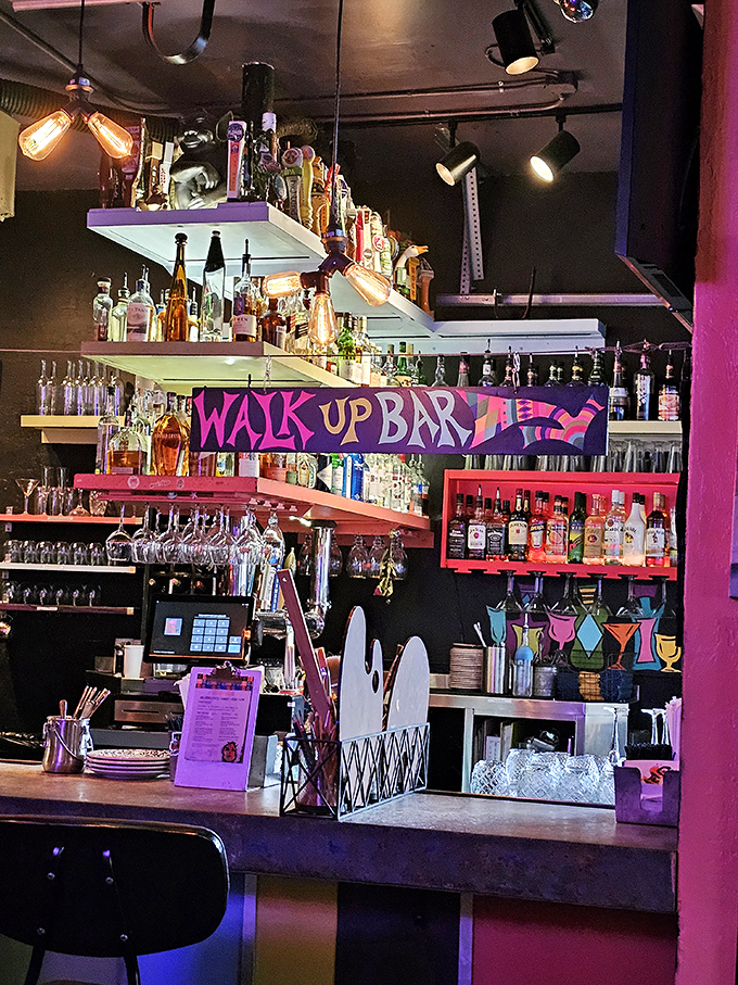 The bar area buzzes with energy while artistic masterpieces provide the perfect backdrop.