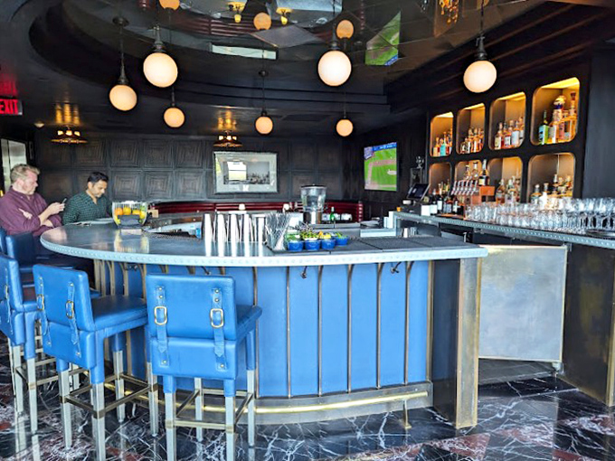 A bar that says "your martini will be perfect" without speaking a word. Those blue chairs are practically begging you to settle in for the evening.