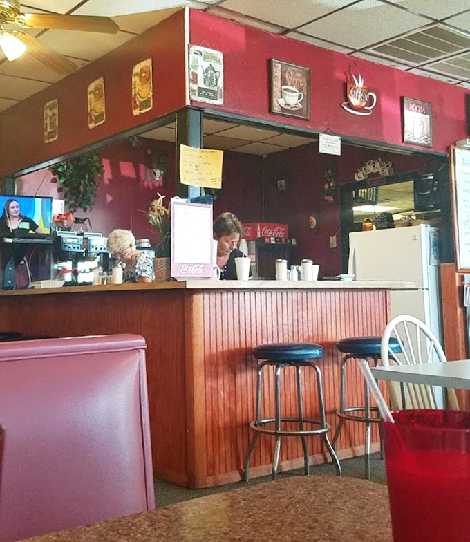 The heart of any great diner: a counter where coffee flows freely and regulars exchange the morning news better than any smartphone app.