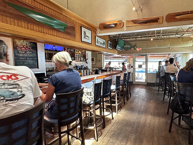 The bar area—where strangers become friends and the bartenders likely know more local secrets than the chamber of commerce.