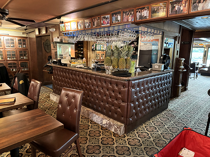 A bar area that says "we take our drinks as seriously as our seafood" &ndash; with hanging glassware that catches light like crystal chandeliers.