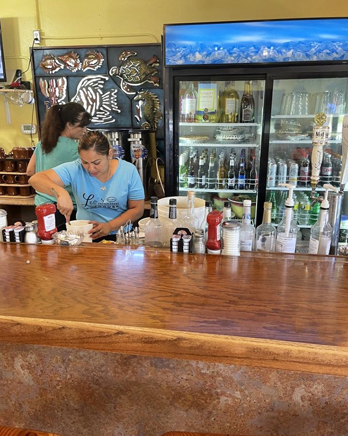 Behind every great restaurant is a bar where magic happens&mdash;this one adorned with sea life art that reminds you you're in Florida.