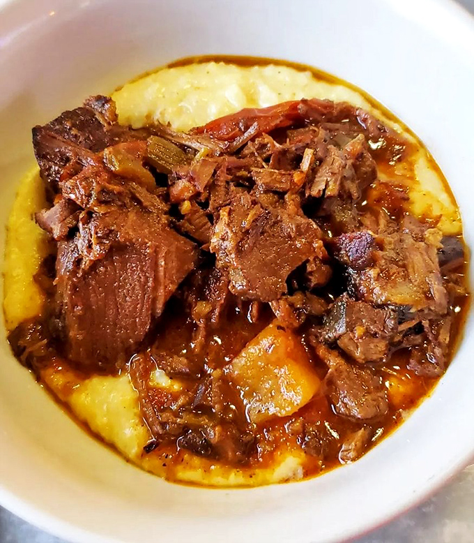 Pot roast swimming in gravy like it's found its forever home in culinary comfort heaven.