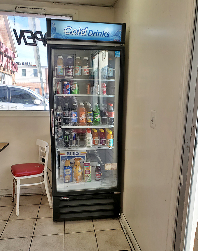 The drink cooler stands ready with the perfect liquid companions for your donut adventure. Because even sweet perfection needs something to wash it down.