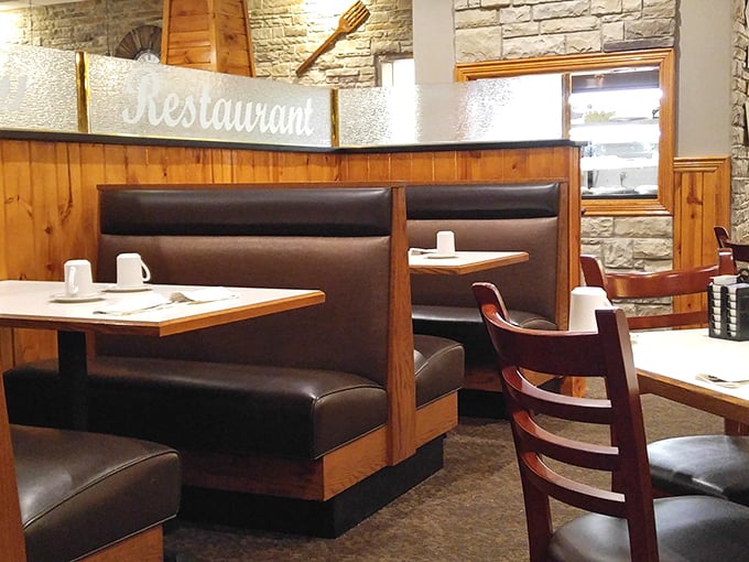 Classic booth seating: where first dates become engagements and family meals become memories. The "Restaurant" sign states the obvious beautifully.