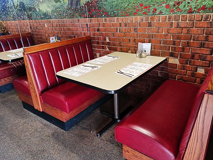 These red vinyl booths have cradled more happy bottoms than a Cadillac dealership, worn to a perfect patina by generations of pasta lovers.