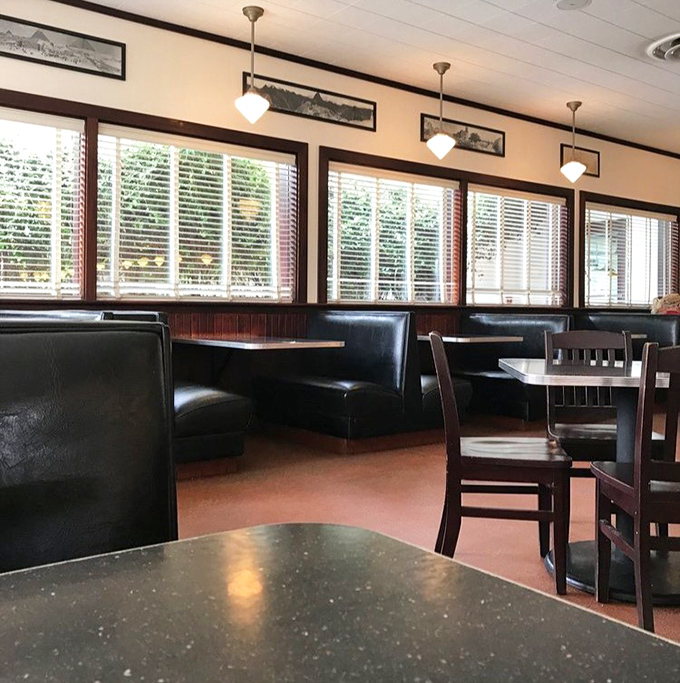 Classic booth seating invites lingering conversations and the kind of unhurried dining that's increasingly rare.