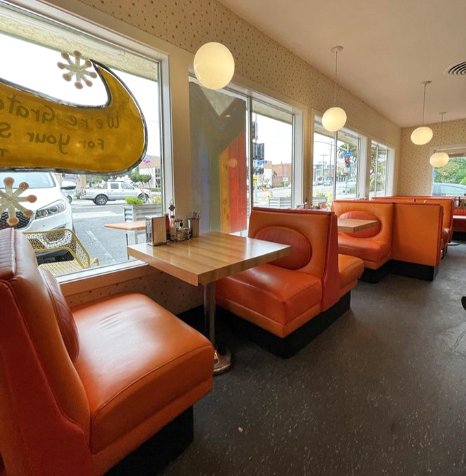 Window booths: where people-watching becomes an Olympic sport and strangers outside become characters in your personal dining narrative.