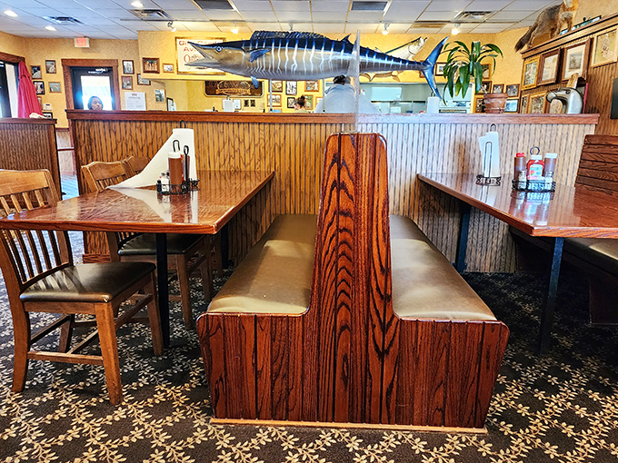 These wooden booths have witnessed more food euphoria than a thousand cooking shows – complete with marlin watching over diners.
