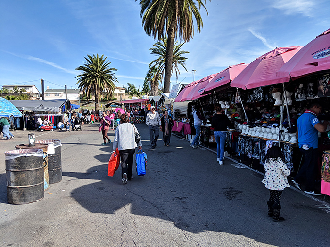 The swap meet's main drag offers a lesson in efficient retail: no fancy displays, just pure shopping potential.